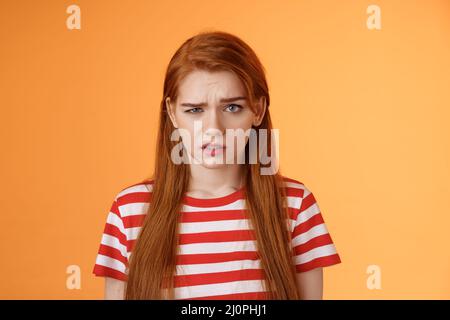 Close-up stupified puzzled redhead perplexed woman, open mouth raise ...
