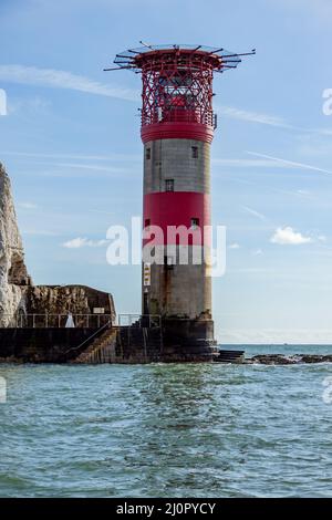 Iconic view of The Needles lighthouse Isle of Wight calm day blue sky ...