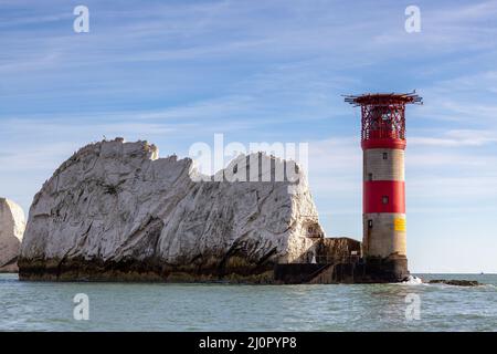 Iconic view of The Needles lighthouse Isle of Wight calm day blue sky ...