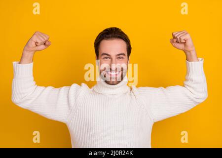 Photo of strong masculine virile guy show two biceps wear green sweater ...