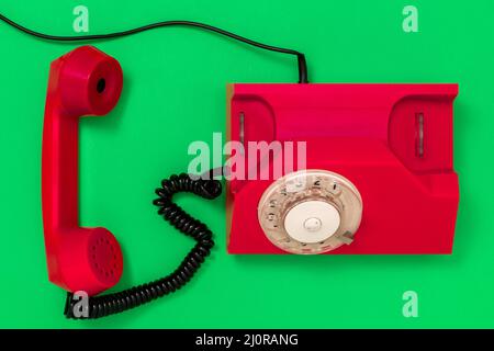 Old red telephone rings with handset off. Rotary antique telephone ...