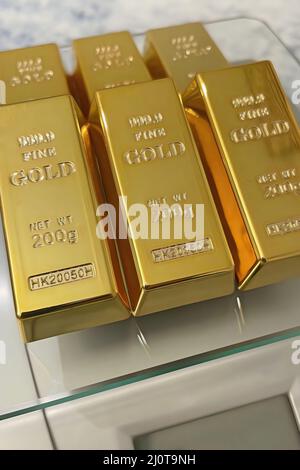 Closeup of gold bars on precision scales Stock Photo - Alamy