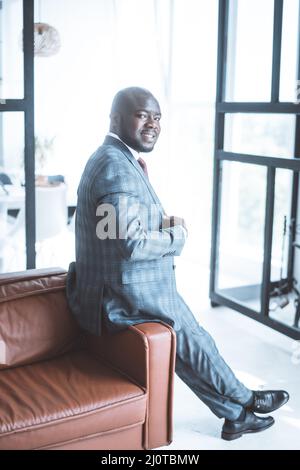 Close-up of a gray checkered suit sleeve with blue lines and black ...