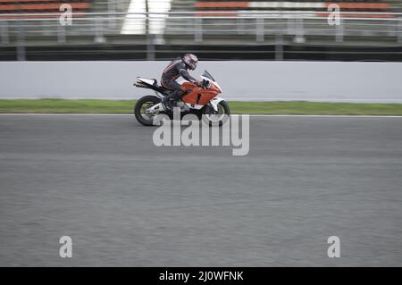 Classic racing sport motorbike running in the asphalt track Stock Photo ...