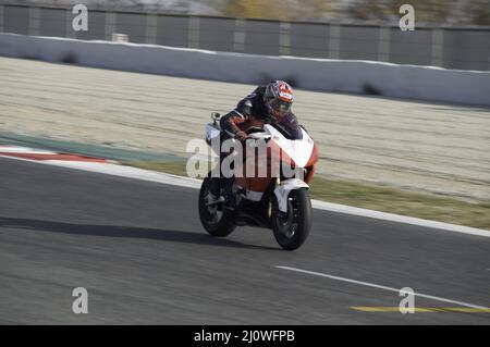 Classic racing sport motorbike running in the asphalt track Stock Photo ...