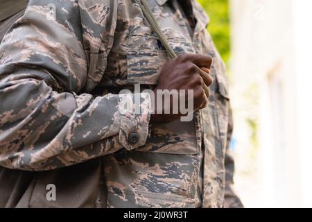 Midsection of man wearing American Flag t-shirt while holding sparkler ...