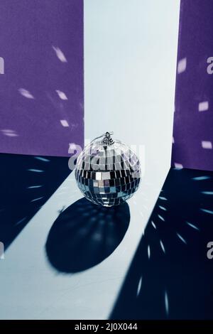Shiny disco balls with rays on navy blue background. Festive party ...