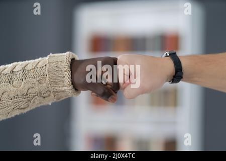 friends making fist pump gesture over coliseum Stock Photo - Alamy