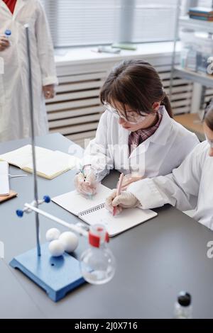 Children doing chemical research in laboratory. Dangerous experiment ...
