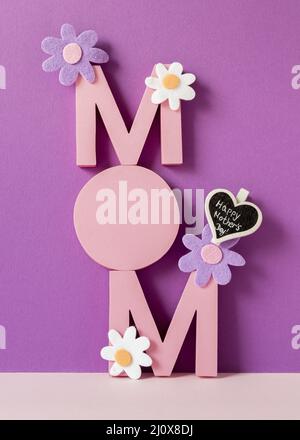 A beautiful floral arrangement with the word MOM in white letters ...