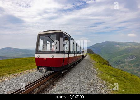 Snowdon Mountain Railway nears the station up the mountain with wide ...