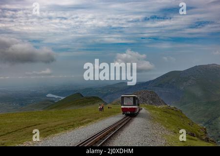 Snowdon Mountain Railway nears the station up the mountain with wide ...