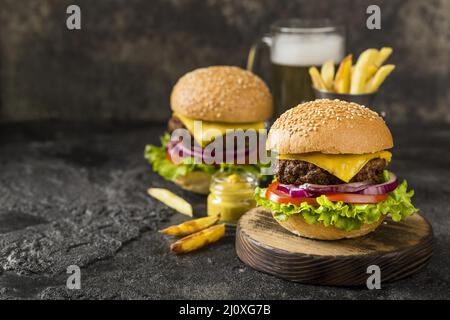 High angle burgers with fries sauce beer Stock Photo - Alamy