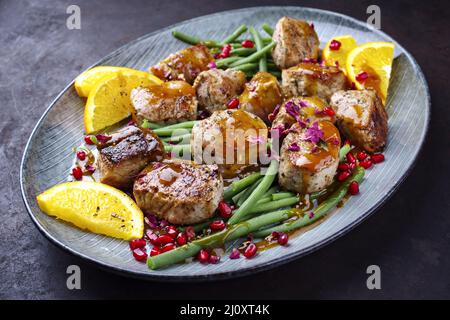Jusy seared pork pigllet tenderloin fillet meat medallions with orange ...