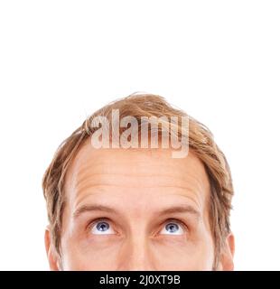 Hmmm... very interesting. the upper half of a young mans face looking ...