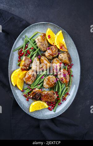 Jusy seared pork pigllet tenderloin fillet meat medallions with orange ...
