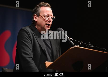 Cologne, Germany. 19th Mar, 2022. Actor Matthias Brandt sits on stage ...