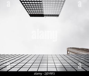 Bottom angle view of glass blue building Stock Photo - Alamy