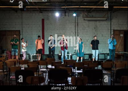 Behind the scenes. Rehearsal at theatre. Large group of actors ...