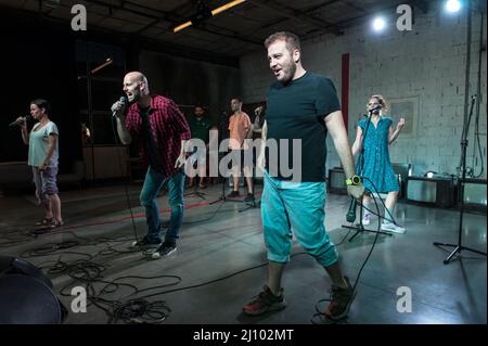 Behind the scenes. Rehearsal at theatre. Large group of actors ...