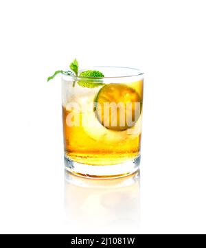 Brandy glass with ice on green background Stock Photo - Alamy