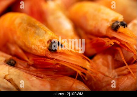 Atlantic shrimp cooked with allspice and bay leaf close-up, surface ...