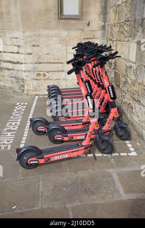Voi Electric Scooters and E-Bikes for hire on a street in the historic ...
