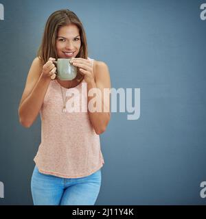 Good days start with a smile. a young family relaxing together at home ...