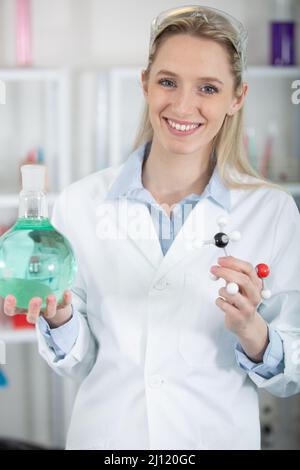 female scientist examining a three dimensional model of dna Stock Photo - Alamy