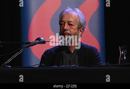 Cologne, Germany. 21st Mar, 2022. Actor Sebastian Koch sits on stage at ...