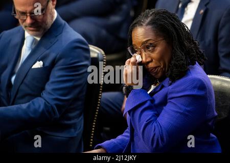 As her husband Patrick Jackson, left, looks on, Judge Ketanji Brown ...