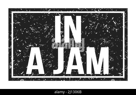 IN A JAM, words written on red stamp sign Stock Photo - Alamy
