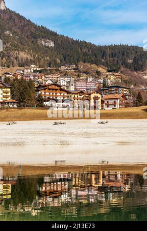 Molveno village, tourist resort on the coast of the lake Molveno ...