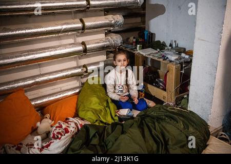 a child in the basement is sitting on a chair tied with a rope Stock ...