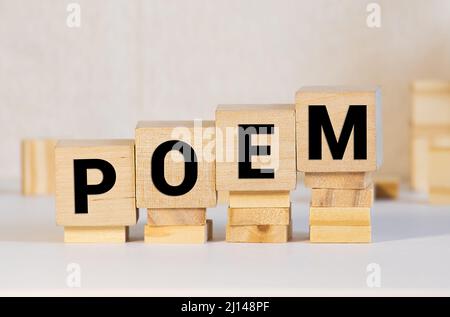 Word poem made with block wooden letters next to a pile of other ...