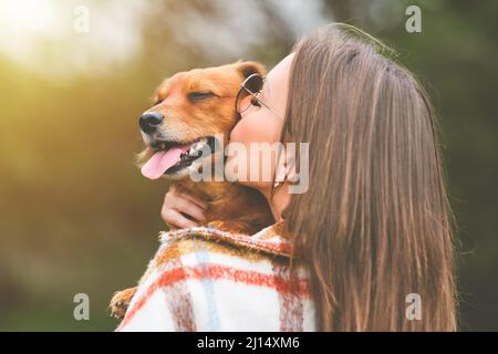 Cheerful woman and dog pet outdoors Stock Photo - Alamy