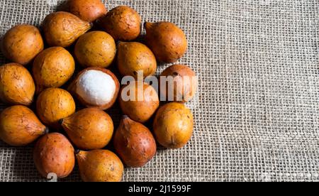 Brazilian fruit named bacupari on top of jute fabric, the fruits are ...