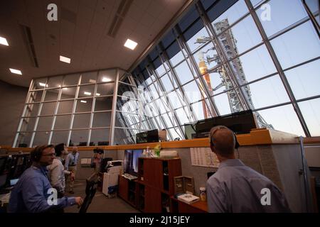 Members of the Artemis I launch team watch out the windows of Firing ...