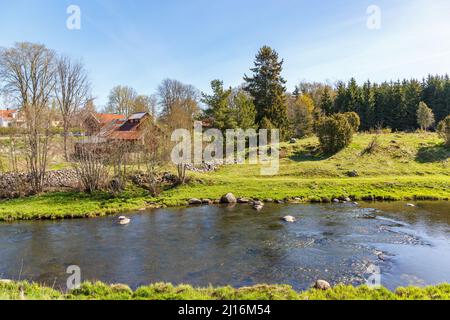 country forest river in early spring with no vegetation on the shores ...
