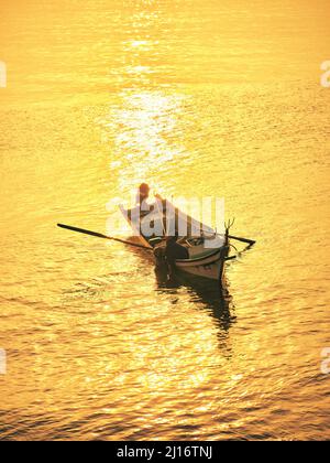 Fishermen work in the morning glow at Ailun Bay ecological aquaculture ...