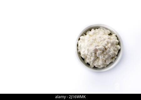 Fresh organic cottage cheese on clay dish with spoon and natural cream ...