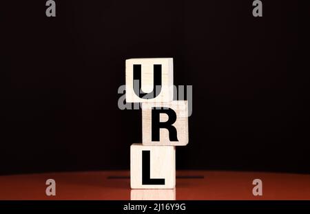Letters abbreviation url www on wooden cubes, on a dark background ...
