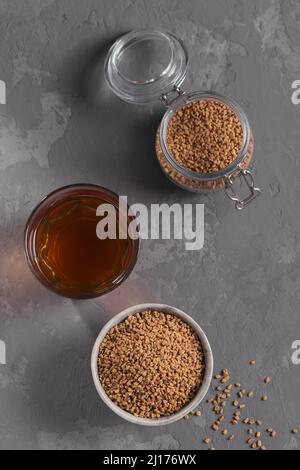 Glass of Egyptian fenugreek yellow tea, Helba or Methi Dana drink and ...