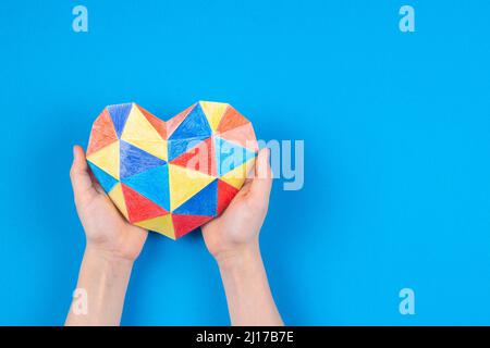 Colorful puzzle pieces and origami on pink background. World Autism ...