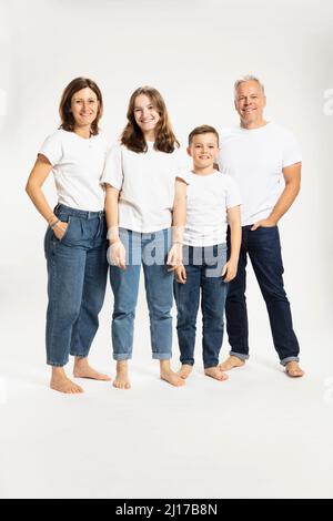 Standing in the studio against white background. Cheerful couple is ...