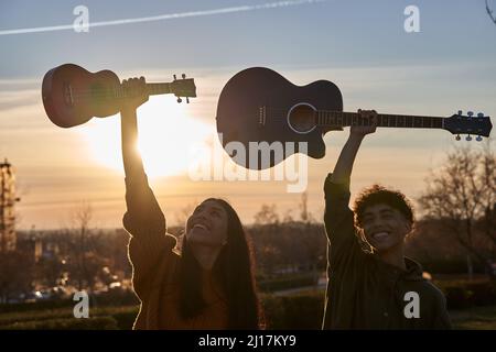 Young hispanic artist couple smiling happy doing picture symbol with ...