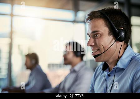 Reliable customer service is just a call away. Portrait of a friendly ...