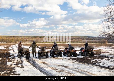 A row of people with their ATVs during winter in Kharkiv, Ukraine Stock ...