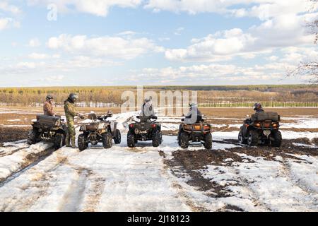 A row of people with their ATVs during winter in Kharkiv, Ukraine Stock ...