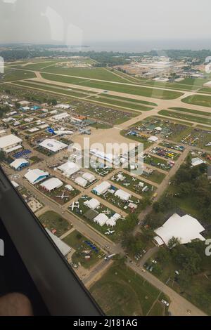 An aerial view of EAA Airventure grounds with planes and tents Stock ...